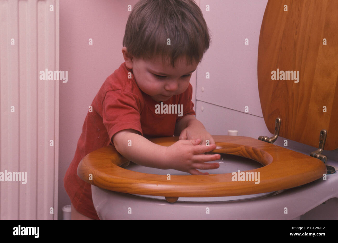 Child in the toilet hi-res stock photography and images - Alamy