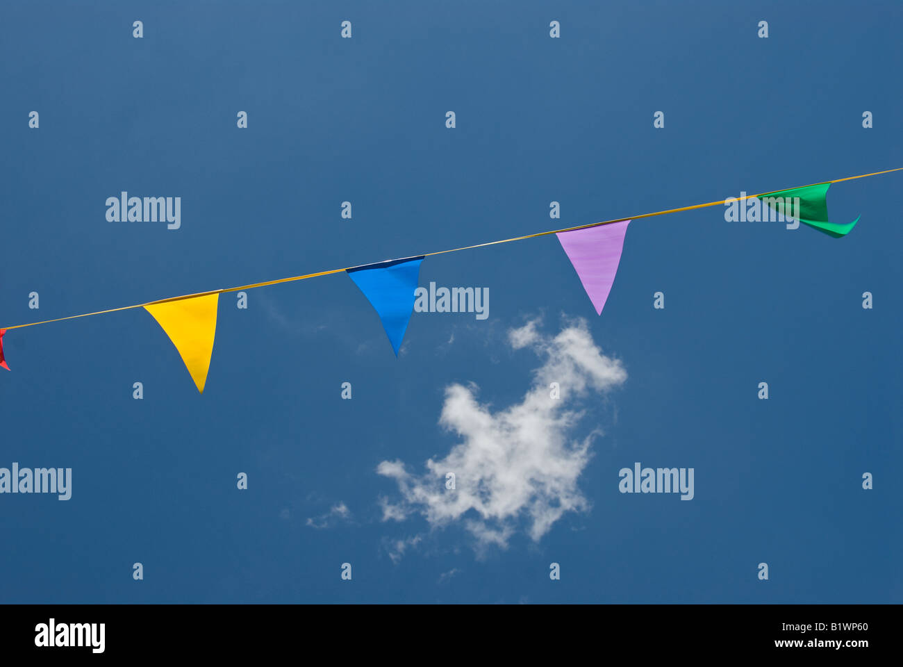 Stock photo of bunting flying against a clear blue sky The image was ...
