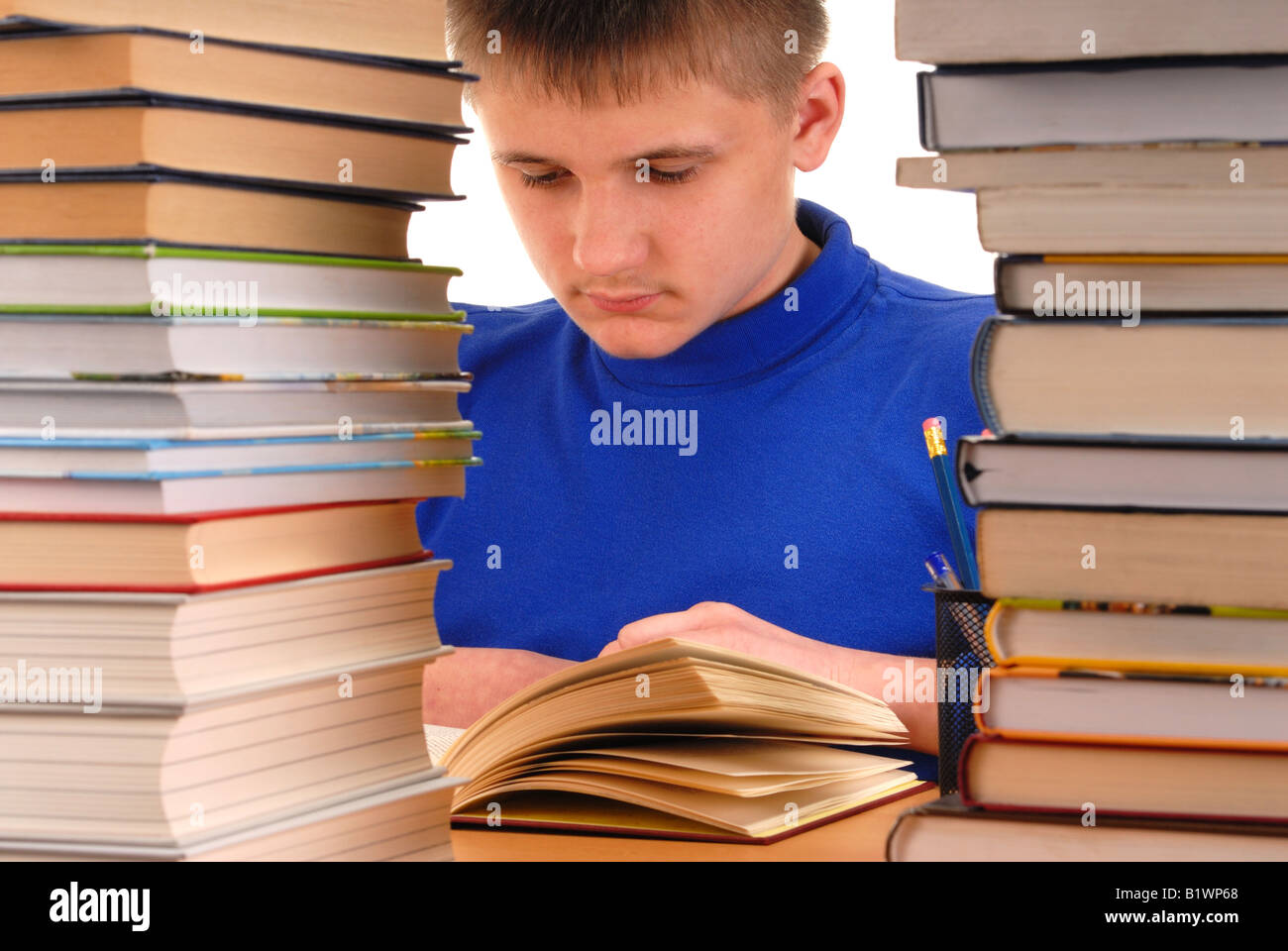 Teenager Reading Books Stock Photo - Alamy