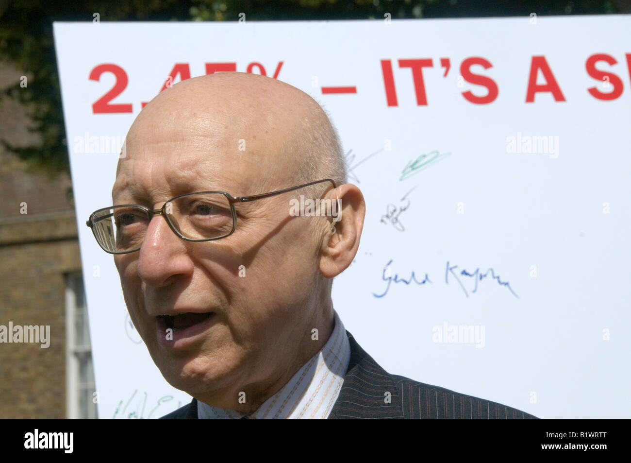 Manchester Labour MP Gerald Kaufmann in front board he has signed to ...