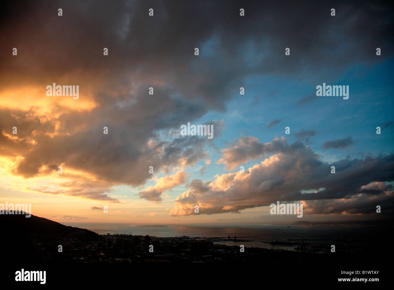Sunset,big dark brooding clouds over Cape Town Harbour, Cape Town ...