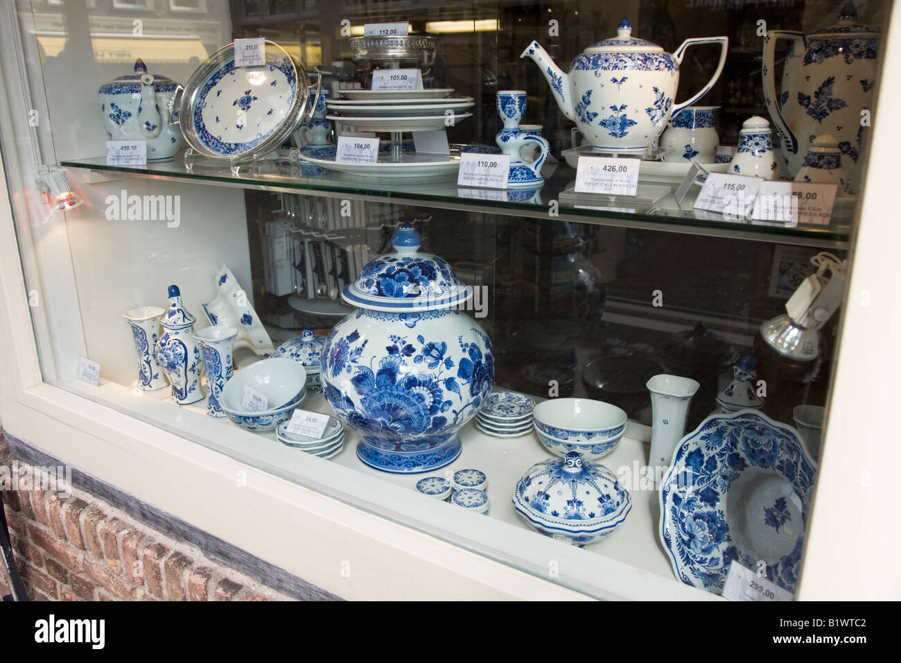 Royal Delftware pottery on display in a shop window in Delft ...