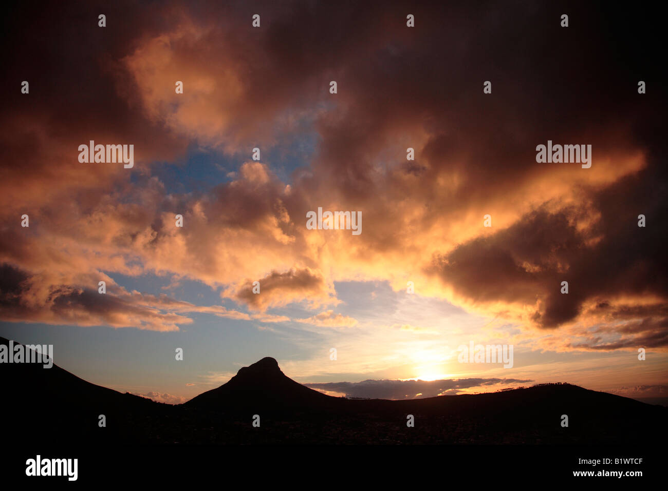 Sunset,big dark brooding clouds over Lion's Head Mountain Cape Town ...