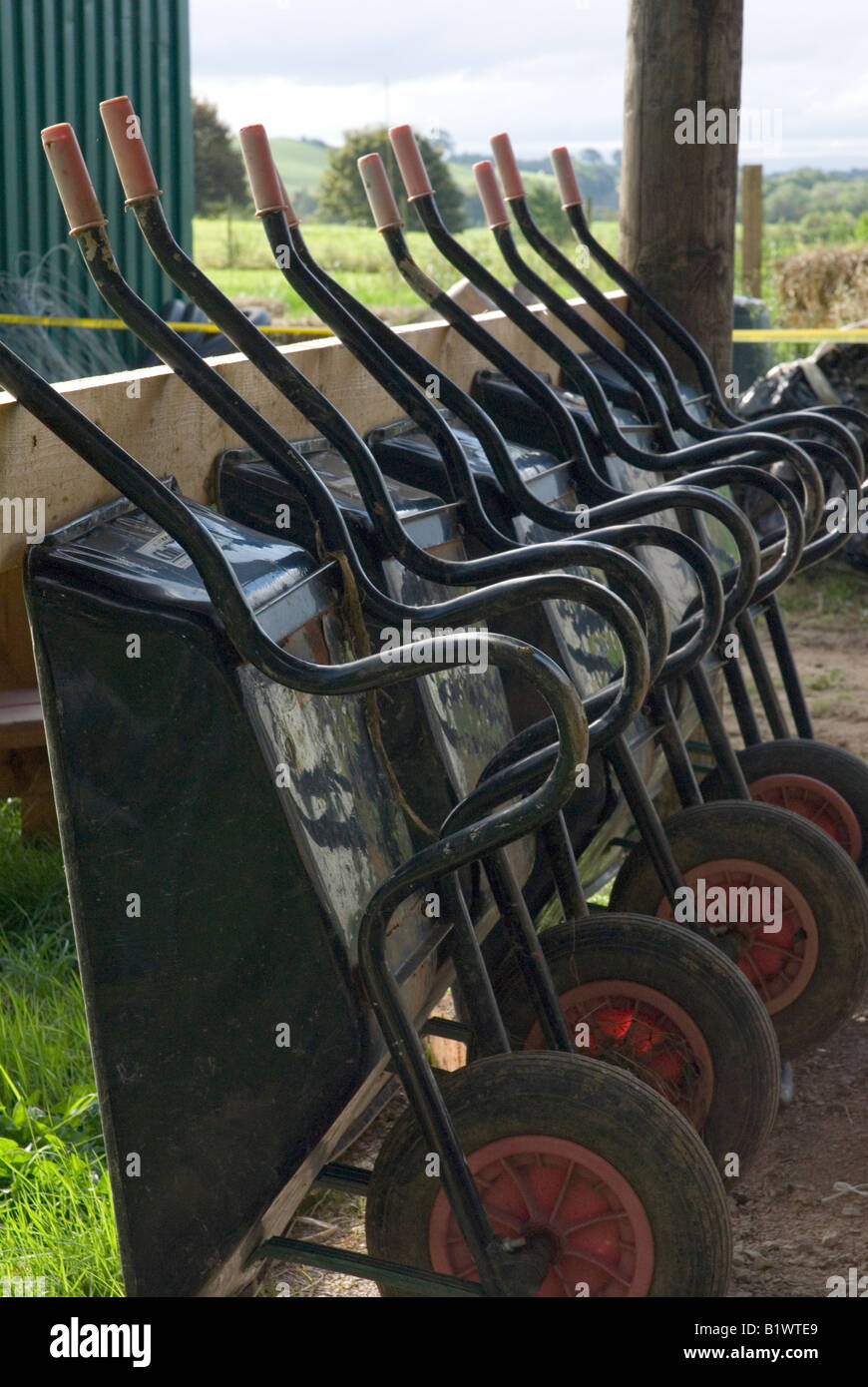 Wheelbarrows stacked up on a farm Stock Photo - Alamy
