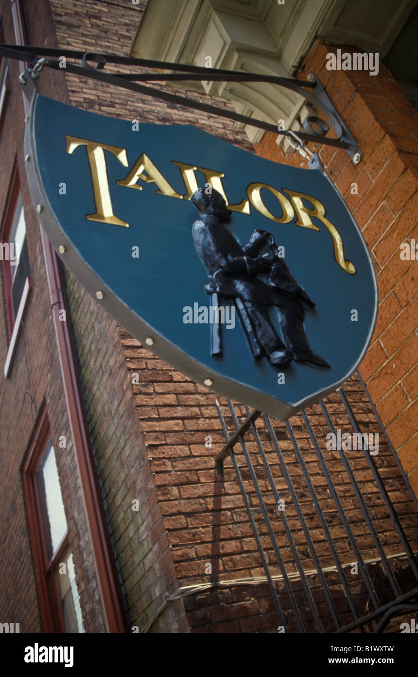 Hand carved tailor shop store wooden sign Stock Photo - Alamy