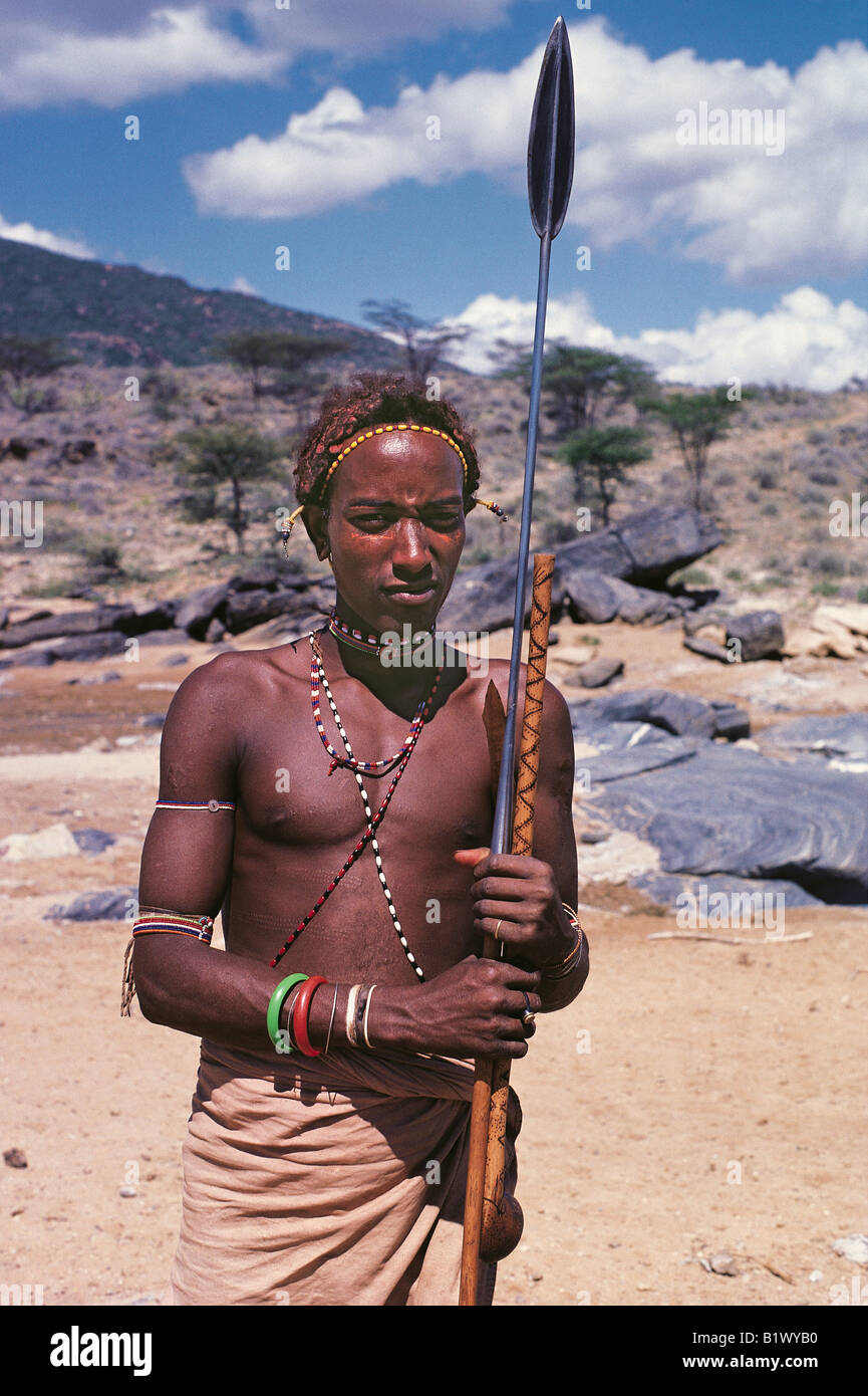 Samburu moran or warrior in traditional dress wearing crossed over bead ...