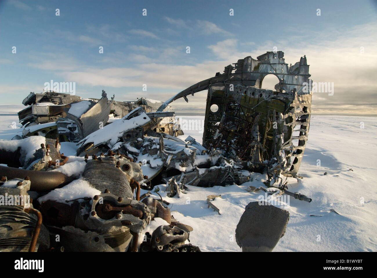 Arctic airplane wreck covered in snow in Resolute Bay, Nunavut. This area is littered with old ...