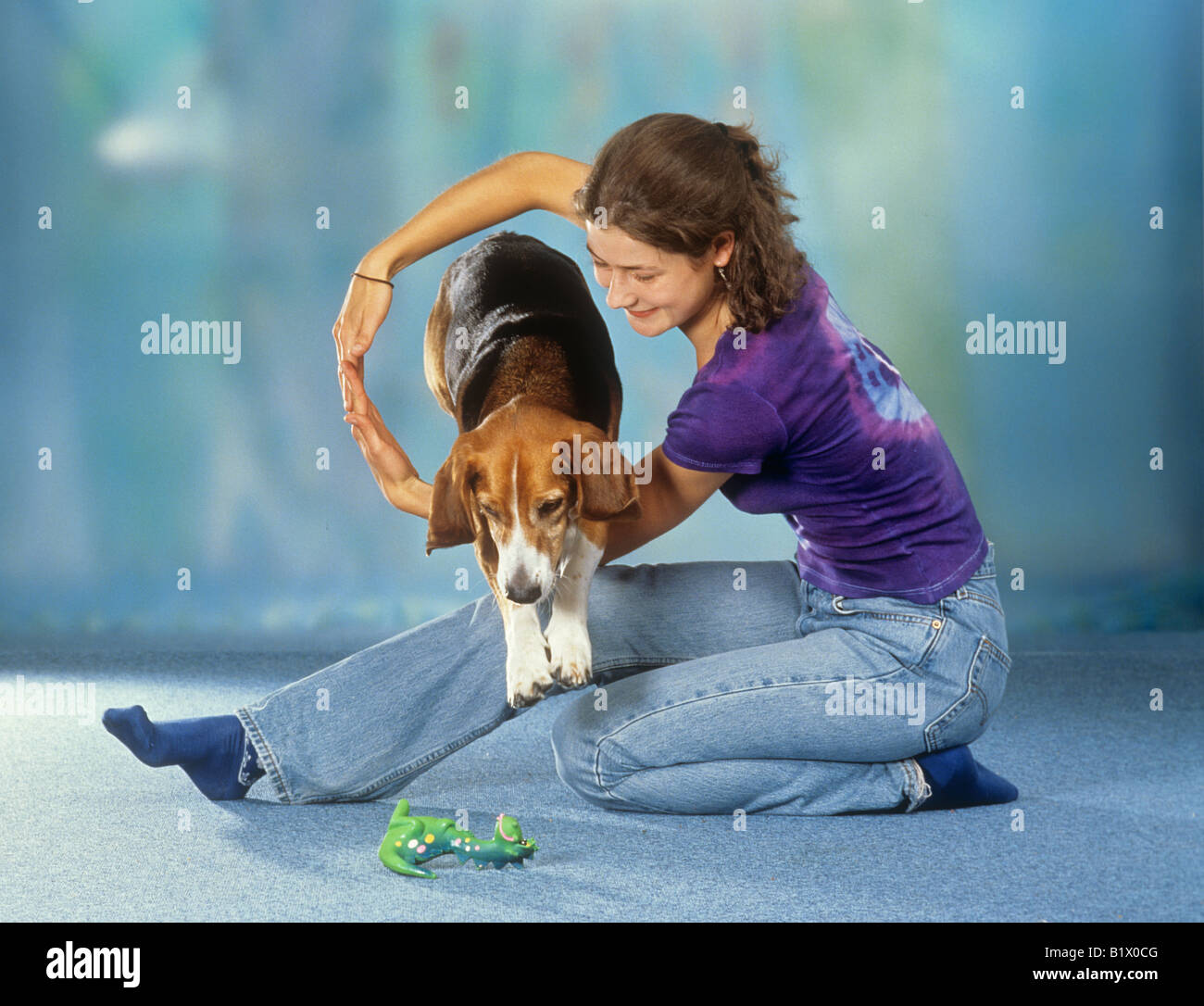 game between dog and woman Stock Photo - Alamy