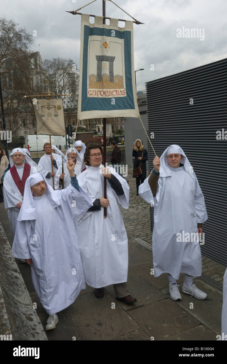 The Druid Order in white robes carry their banner to Tower Hill for the ...