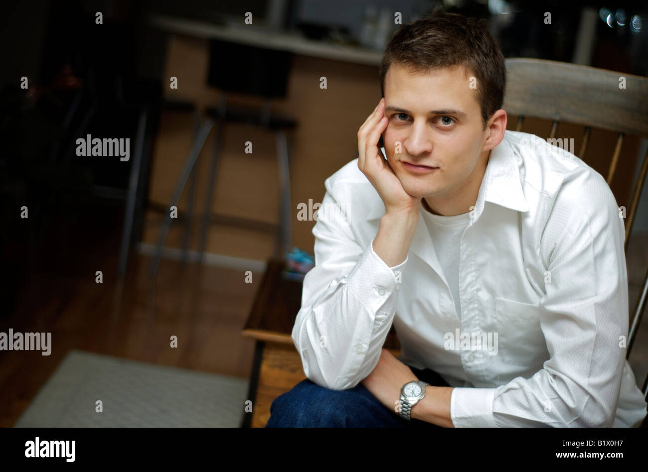 Smart looking man dressed casual posing in white shirt, jeans, casual ...