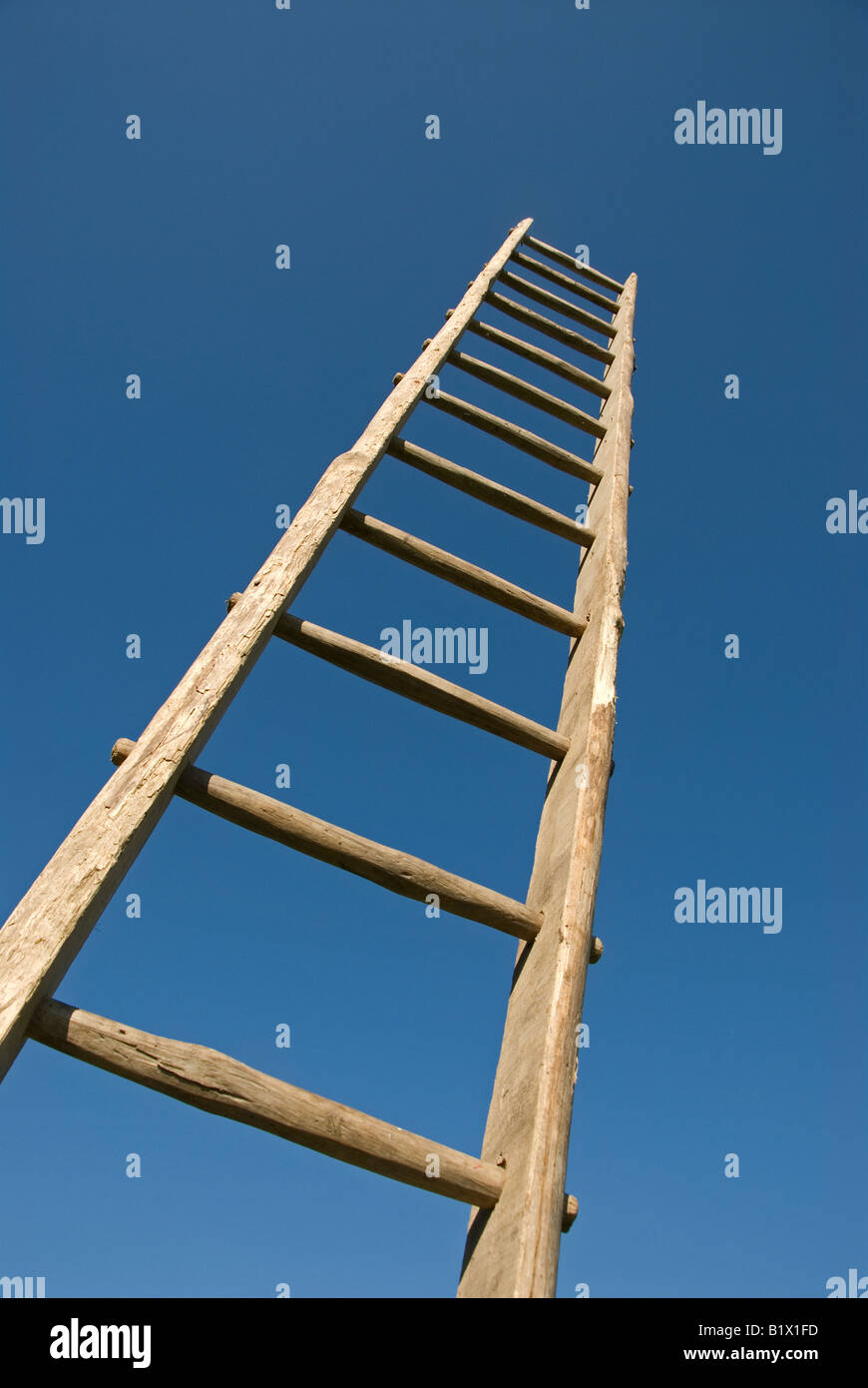 Stock photo of an old wooden ladder pointing up into the blue sky This ...