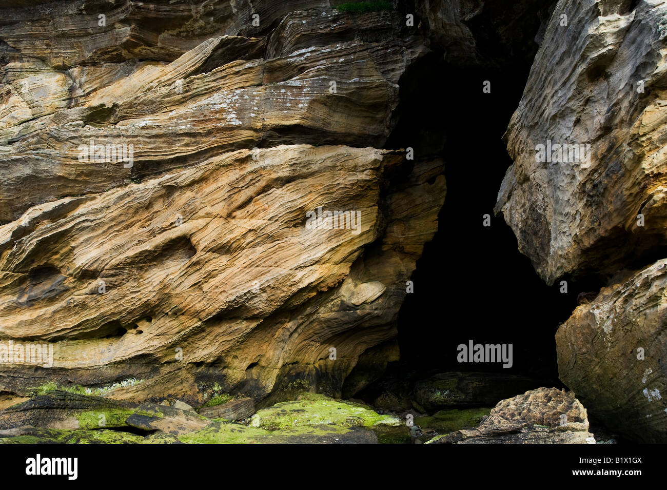 Sandstone rock and cave formation. Hopeman bay coastline, Morayshire ...