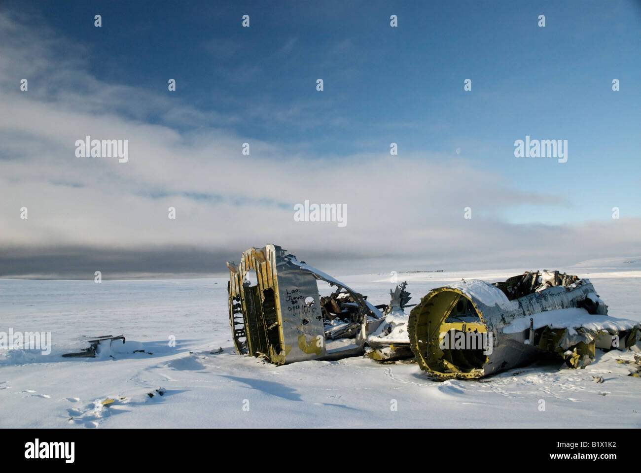 Arctic airplane wreck covered in snow in Resolute Bay, Nunavut. This area is littered with old ...