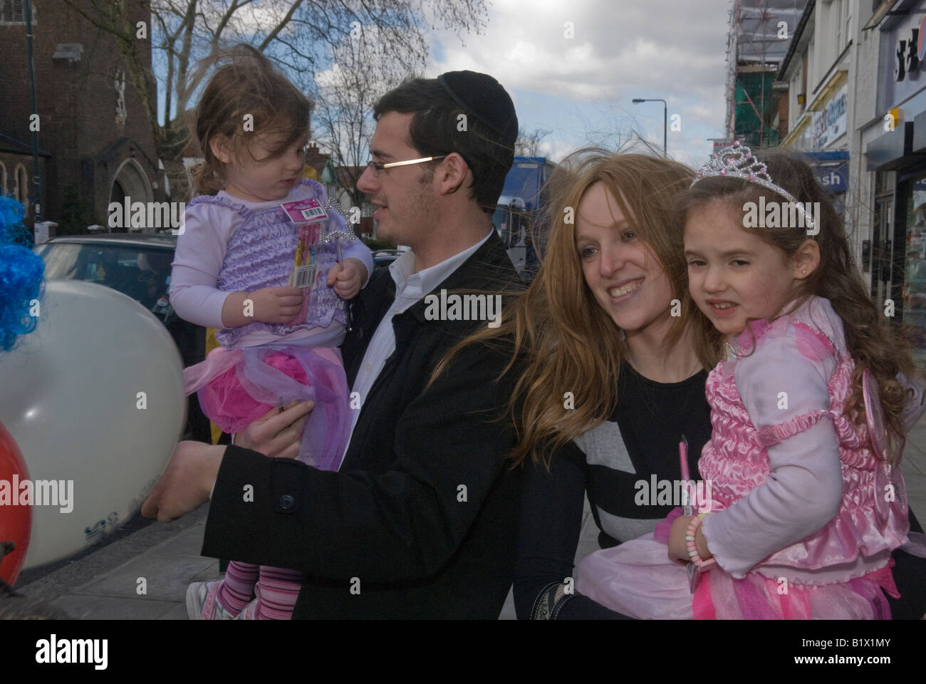 Jewish parents and children celebrate the Jewish festival of Purim in ...