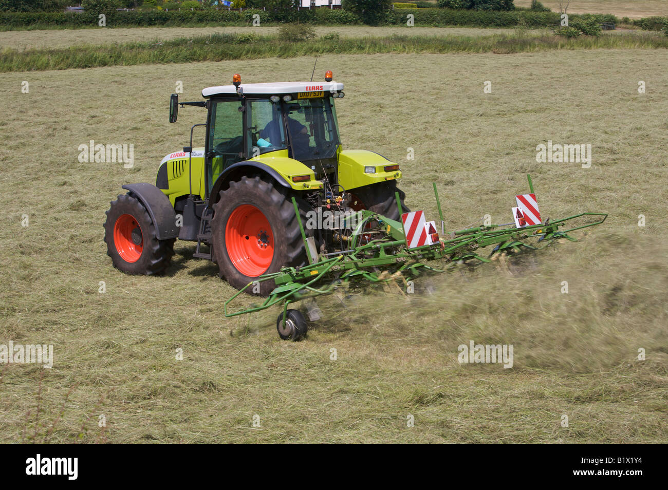 Harvest hay tractor hi-res stock photography and images - Alamy