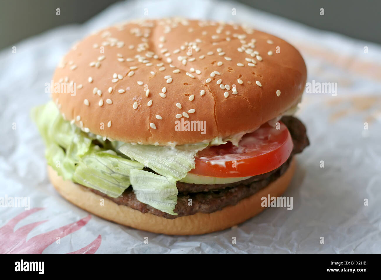 Fastfood hamburger bun on paper wrapper Stock Photo - Alamy