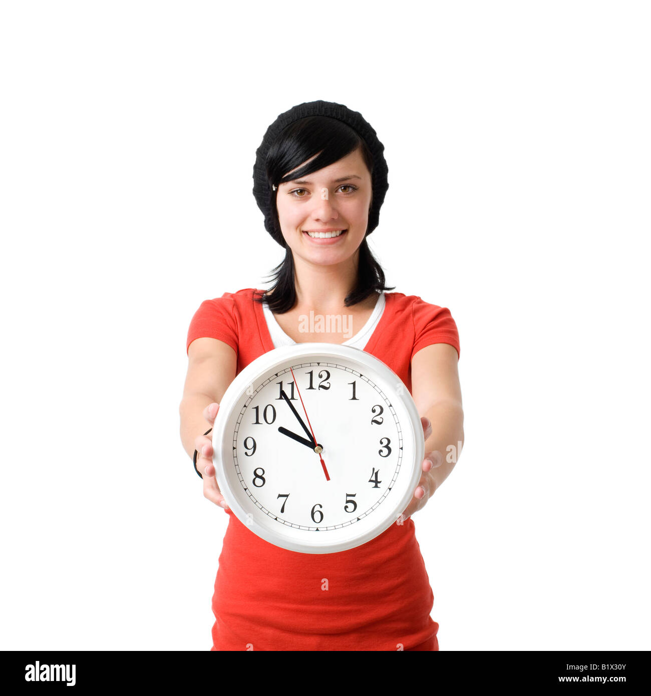 Girl with clock smiles Stock Photo - Alamy