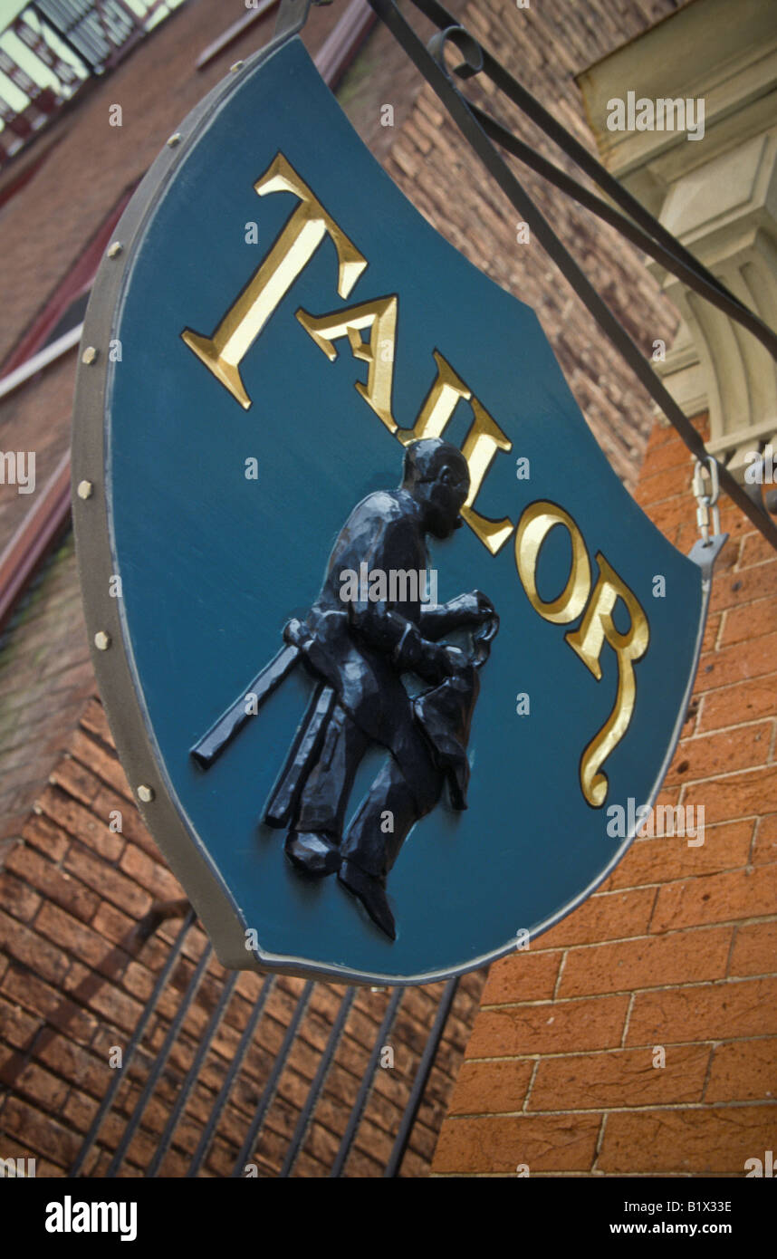 Hand carved tailor shop store wooden sign Stock Photo - Alamy