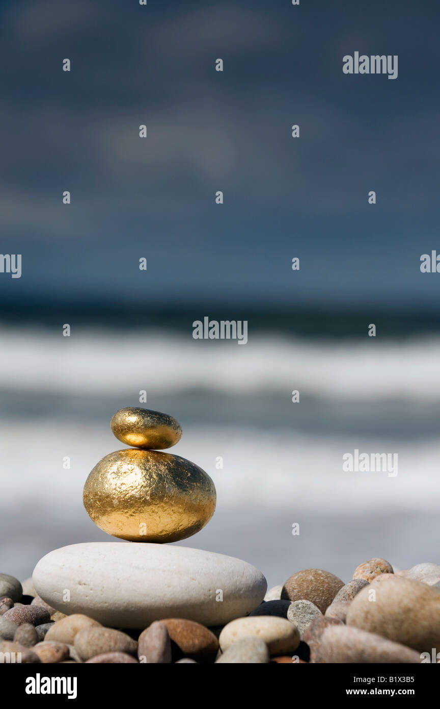 Golden pebbles on a beach at the . Findhorn beach, Morayshire, Scotland ...