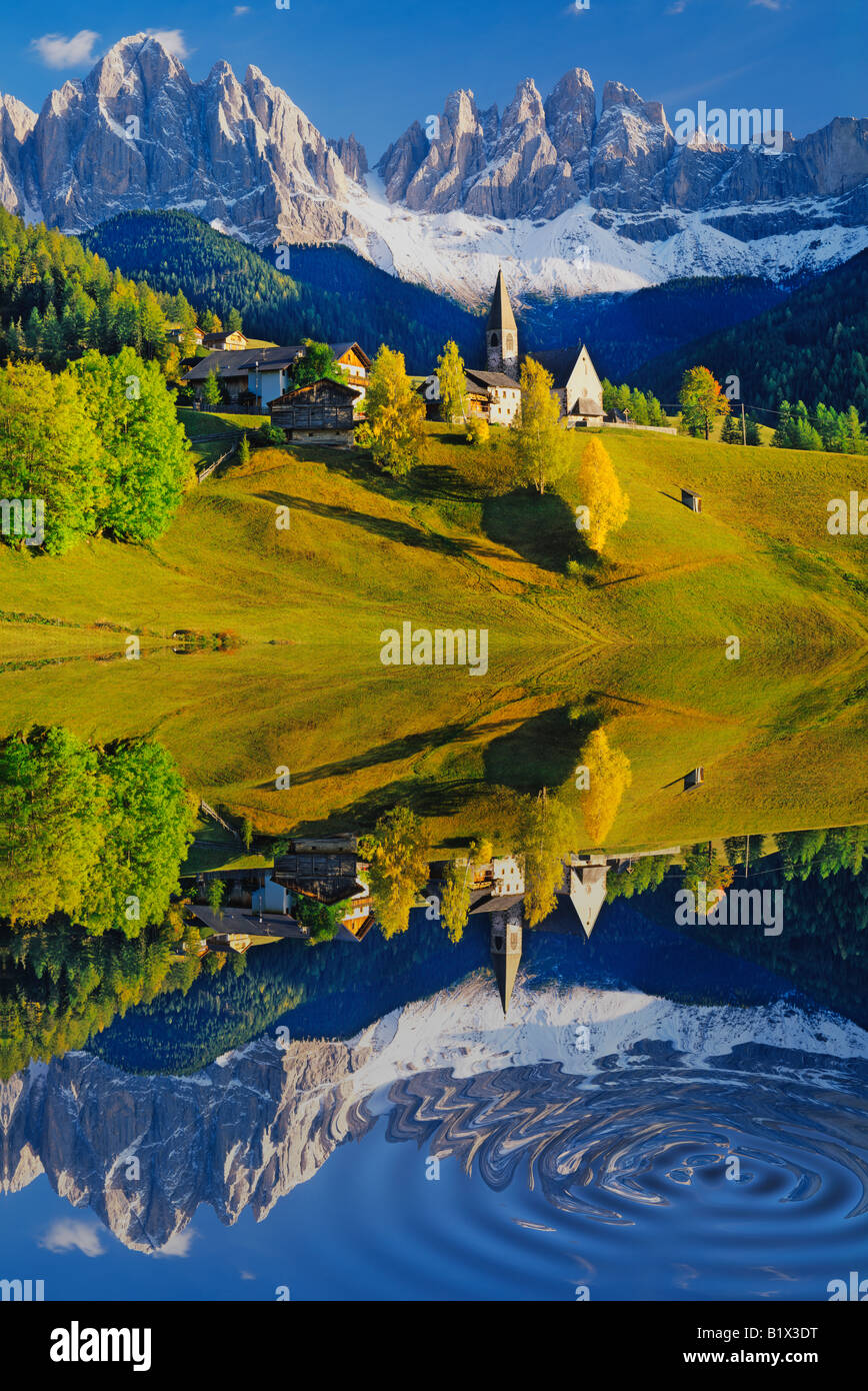 Funes Italy in the Dolomite Mountains reflected in lake Stock Photo - Alamy