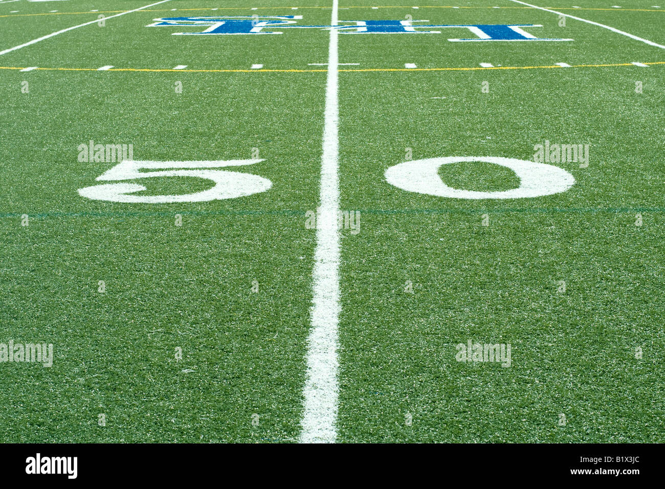Close up of the 50 yard line on a new football field Stock Photo - Alamy