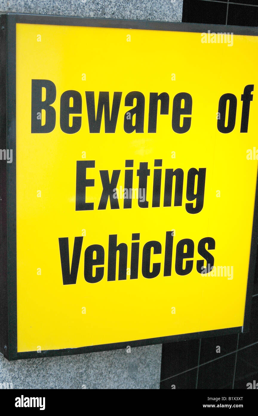 Safety sign, Beware of Exiting Vehicles Stock Photo - Alamy