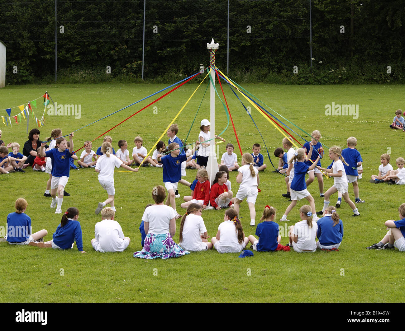 School children from St Mark's school, Cornwall. dancing round the ...