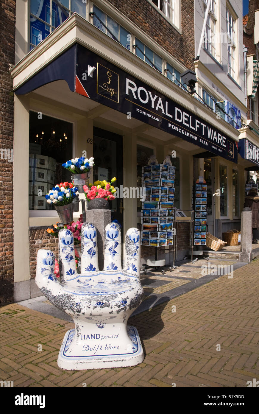 Large ceramic oversized hand seat outside a shop selling Royal ...