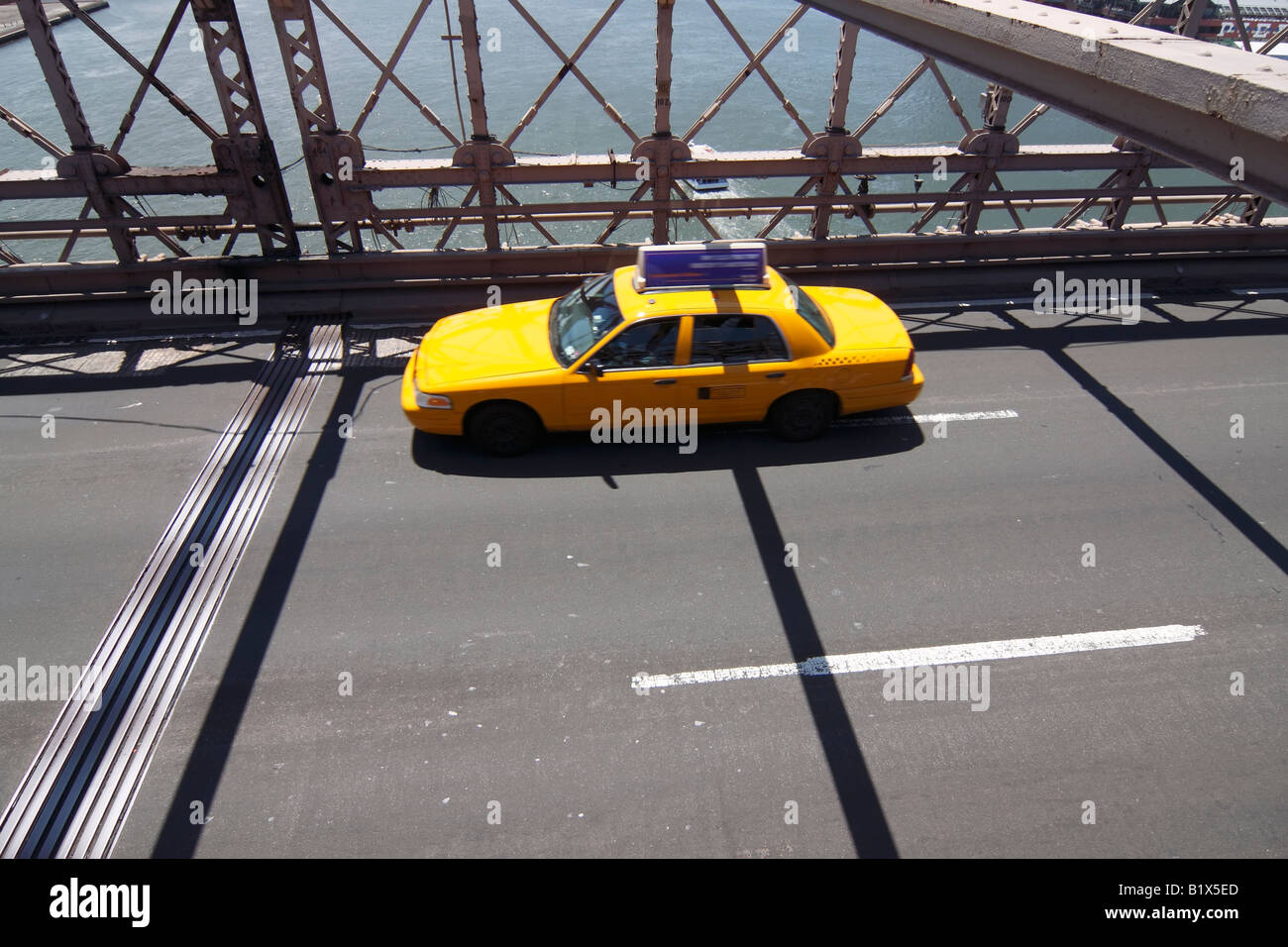 Yellow taxi on Brooklyn bridge - New York City, USA Stock Photo - Alamy