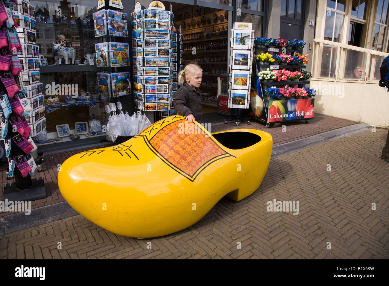 Child and large wooden oversized clog outside a shop in the Markt ...