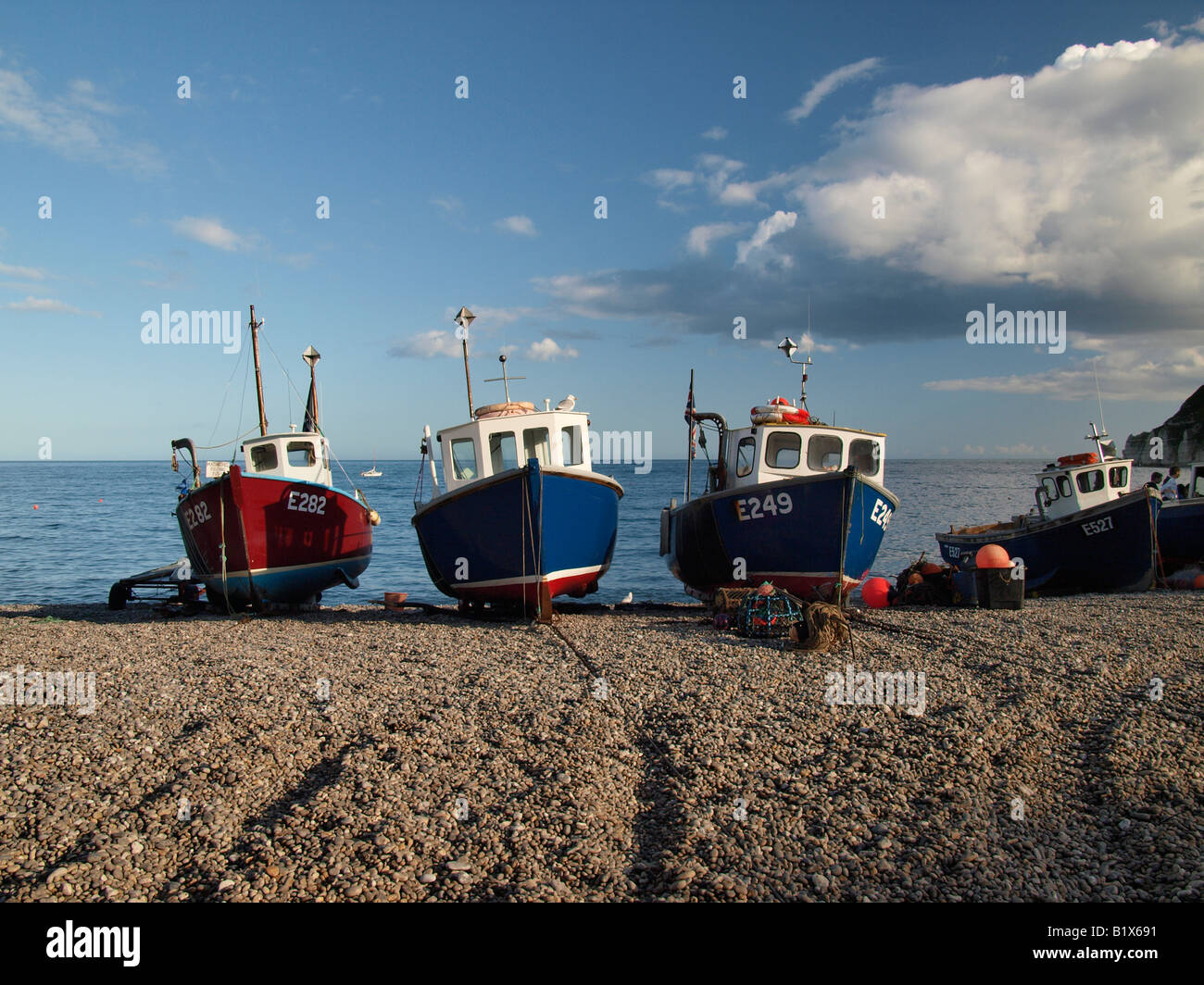 Three boats on beach Stock Photo - Alamy