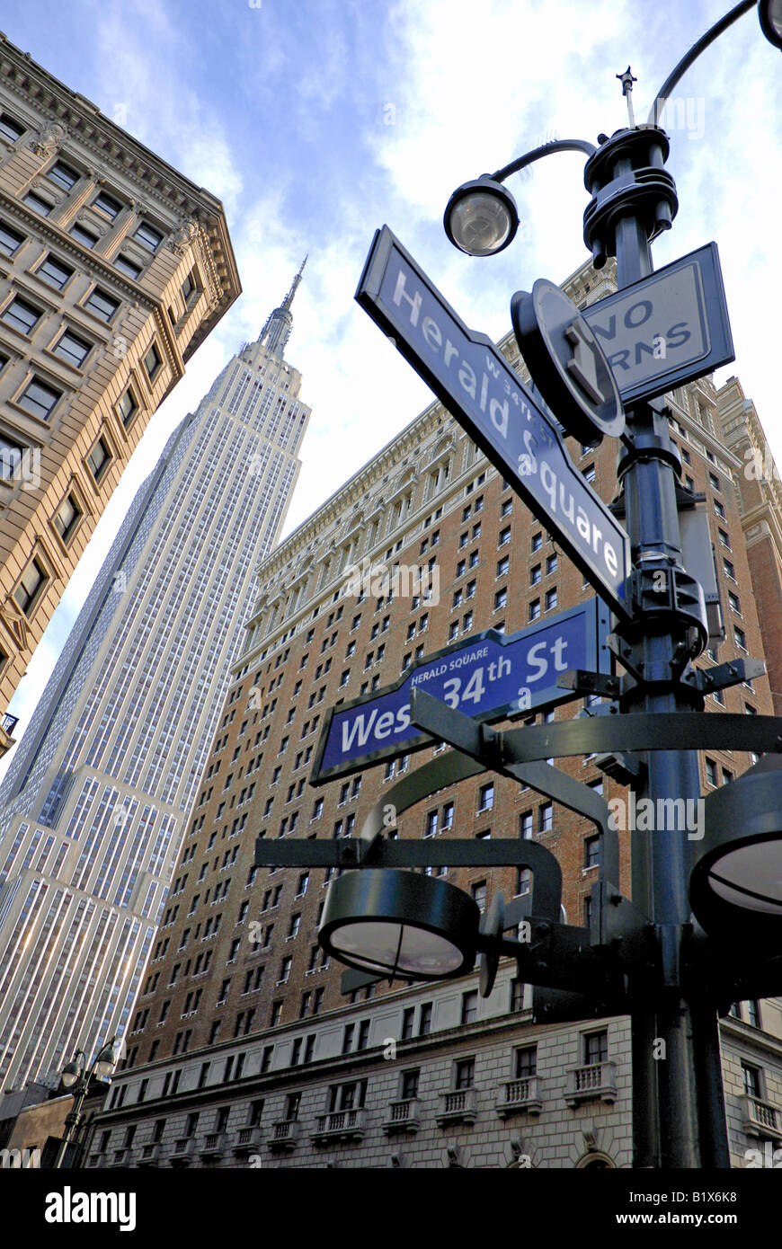 Herald Square street signs with Empire State building in background New ...