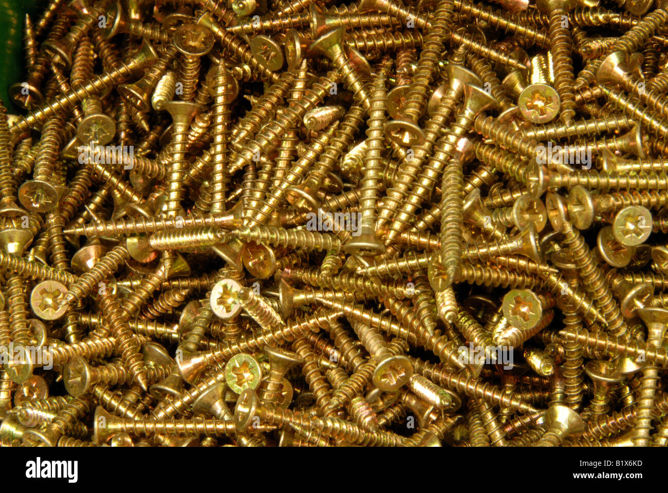 The heap of screws lays on a surface Stock Photo - Alamy
