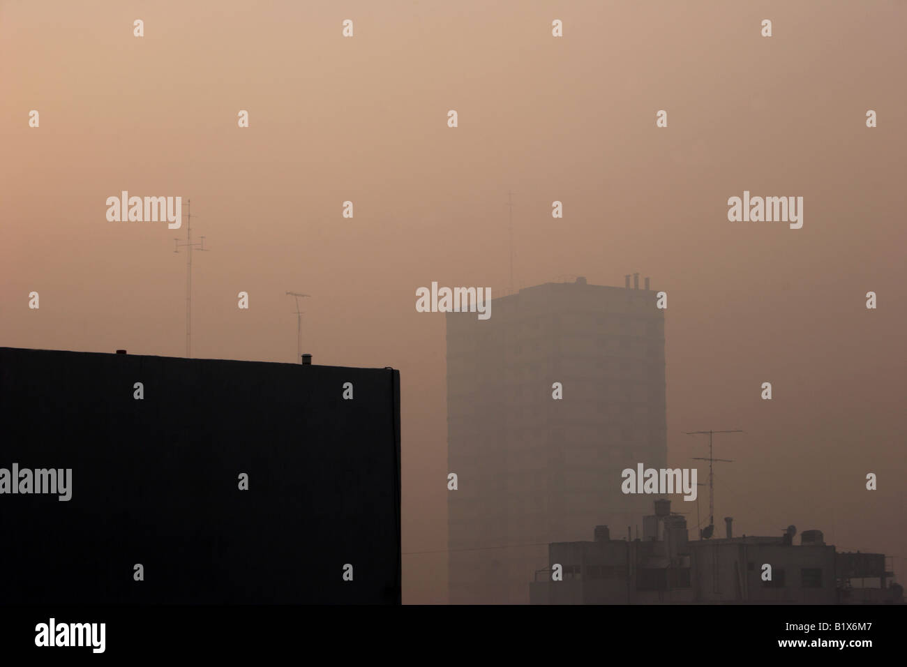 Early morning: smoke & buildings Stock Photo - Alamy