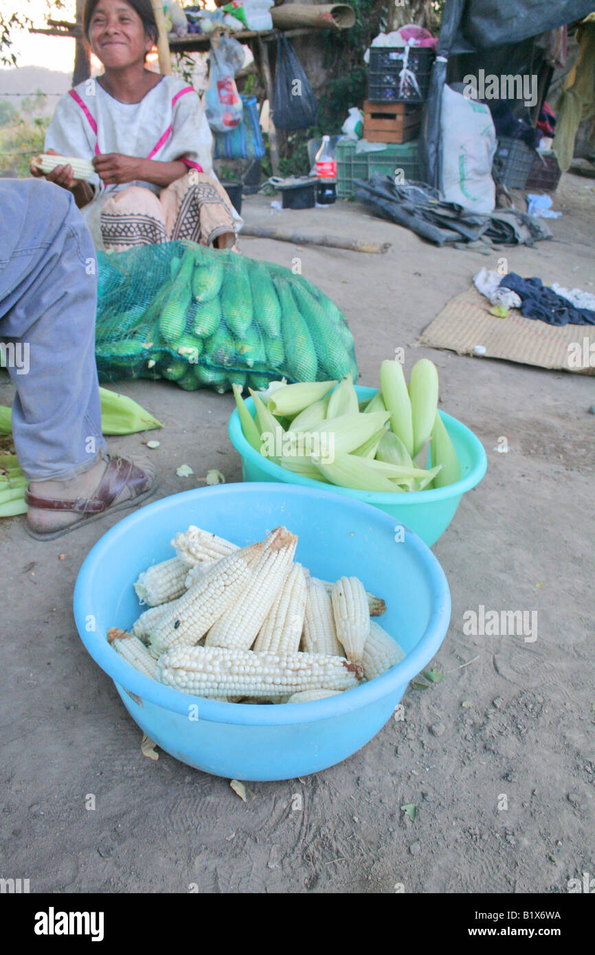 A poor family shucking corn husks for dinner Stock Photo - Alamy