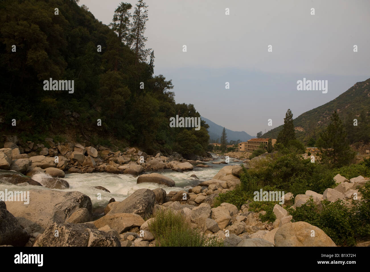 The Merced River flows through Yosemite National Park past the town of ...
