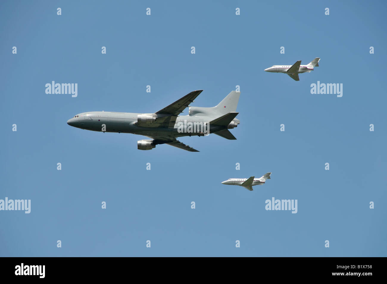 RAF Lockheed Tristar tanker transport aircraft flanked by two HS 125 ...