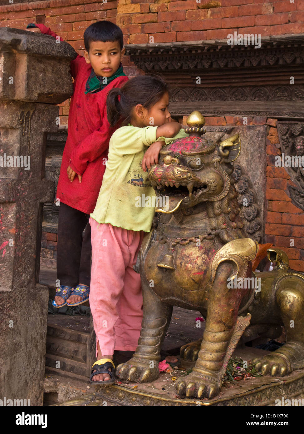Children playing in the street shrine in Bhaktapur (Bhatgaon) Kathmandu ...