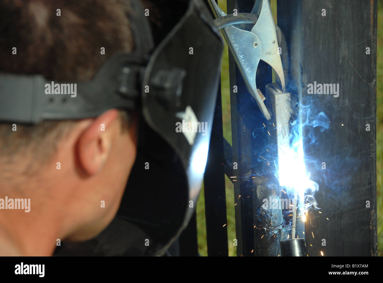 Worker welding steel in a mechanical workshop Stock Photo - Alamy
