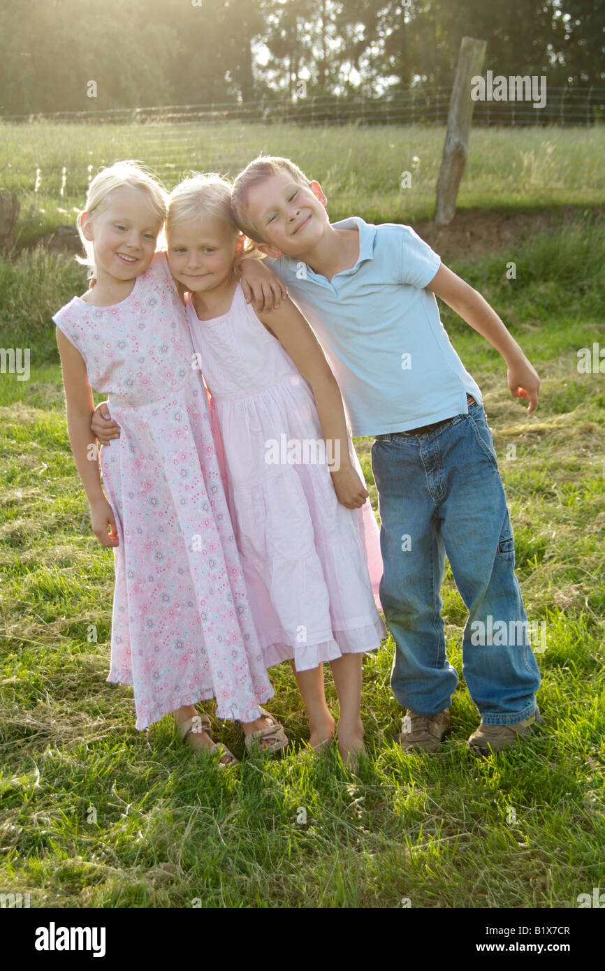 Children playing on a meadow in summer, Eyendorf, Lower Saxony, Germany ...