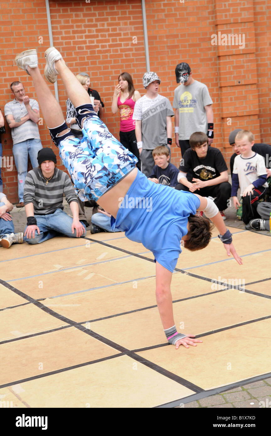 Breakdancer being watched by crowd in Derbyshire England Stock Photo ...