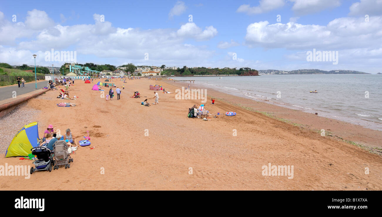 Panoramic image of holidaymakers enjoying the sandy beach at ...