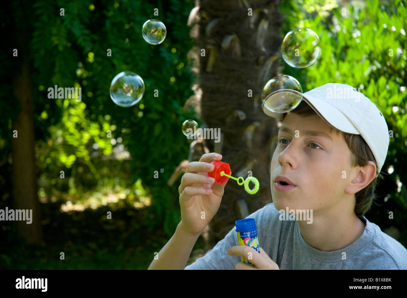 a child playing with soap bubbles Stock Photo - Alamy