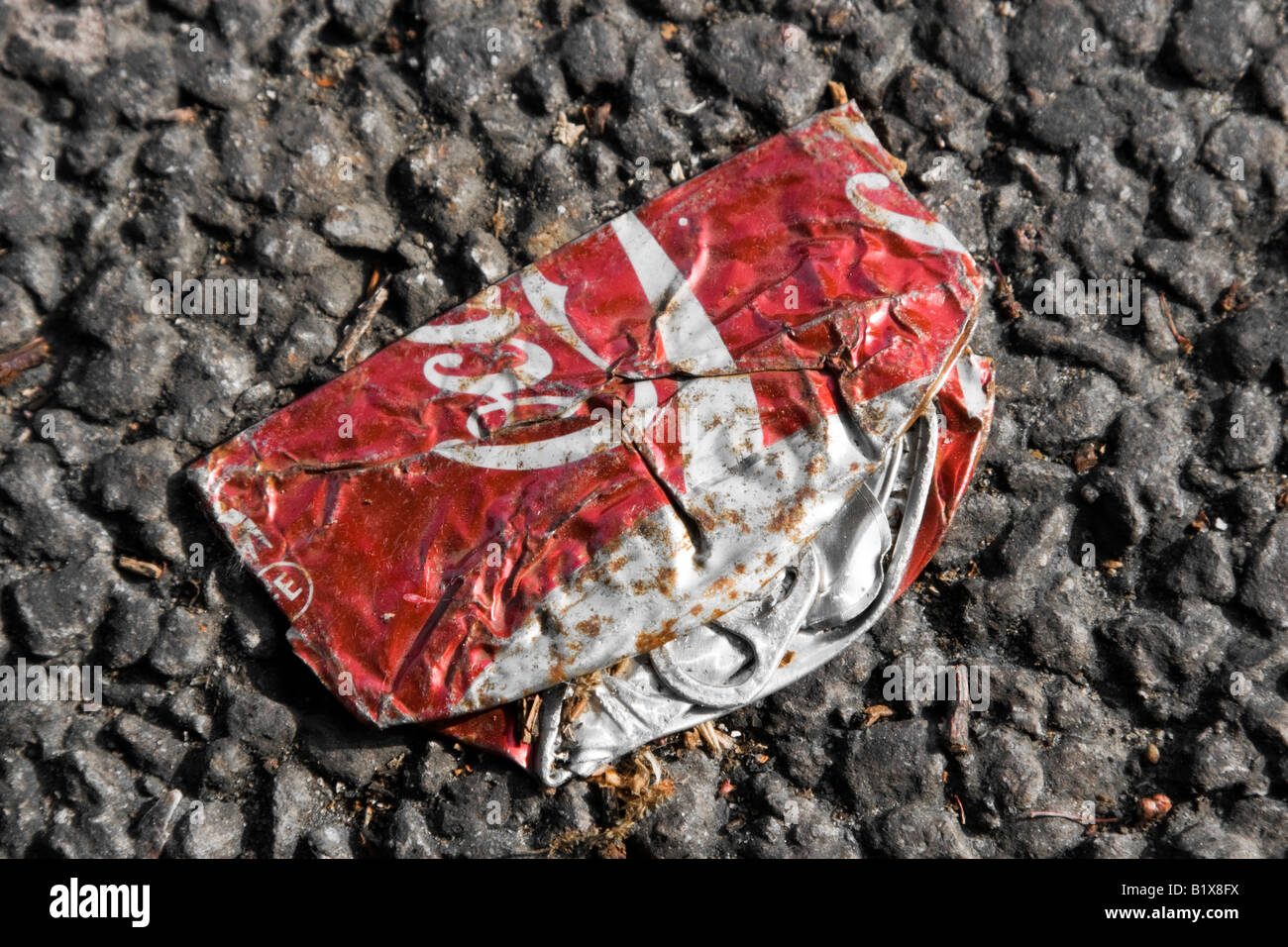 Coca Cola can crushed flattened on the street Stock Photo - Alamy