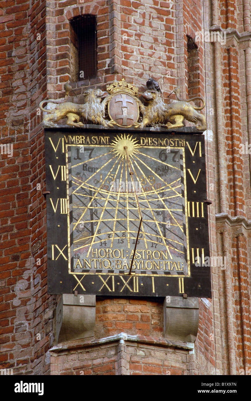 ancient wall clock on the wall of town hall Gdansk Poland Stock Photo ...