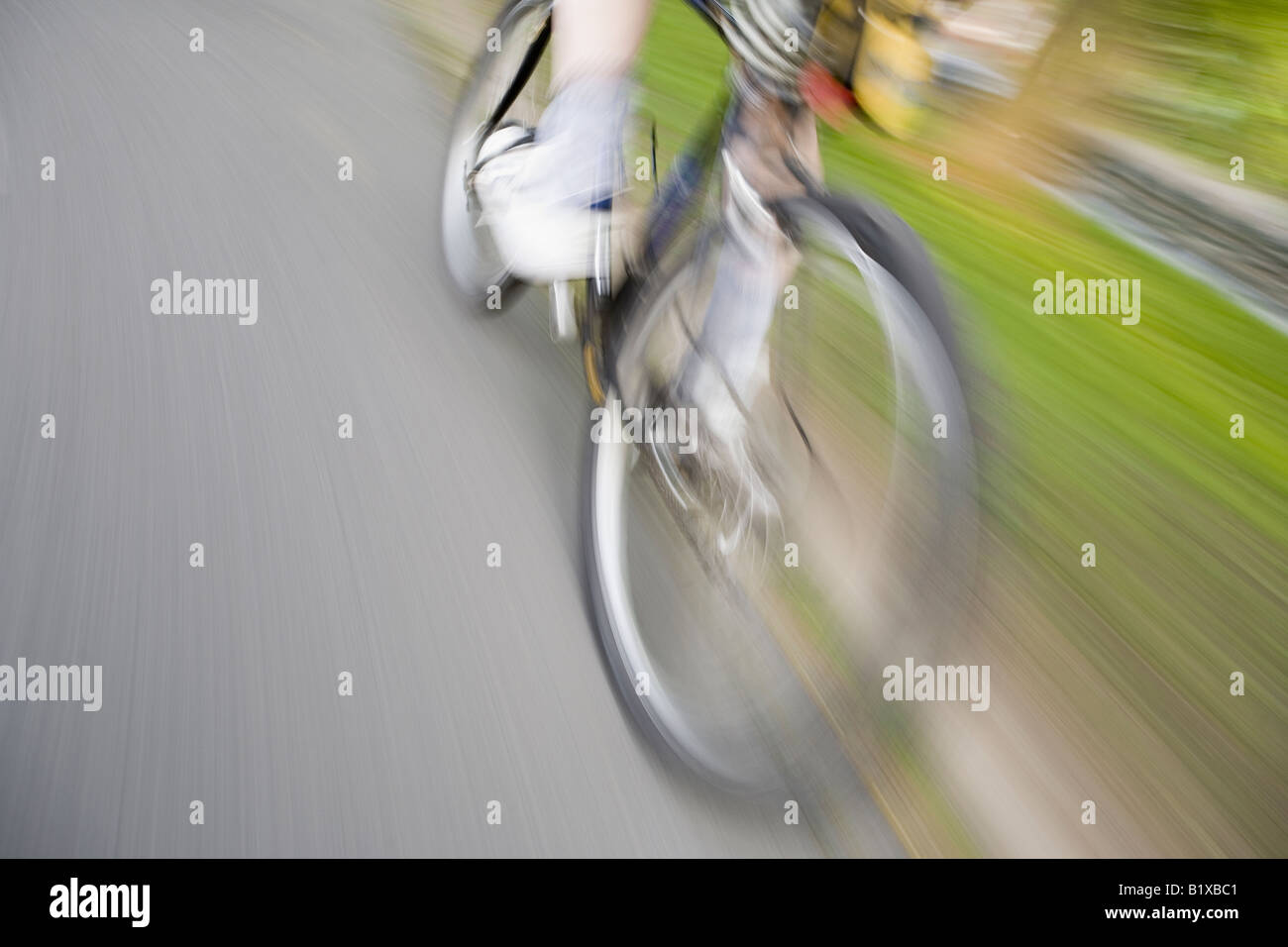 Person riding bicycle road hi-res stock photography and images - Alamy