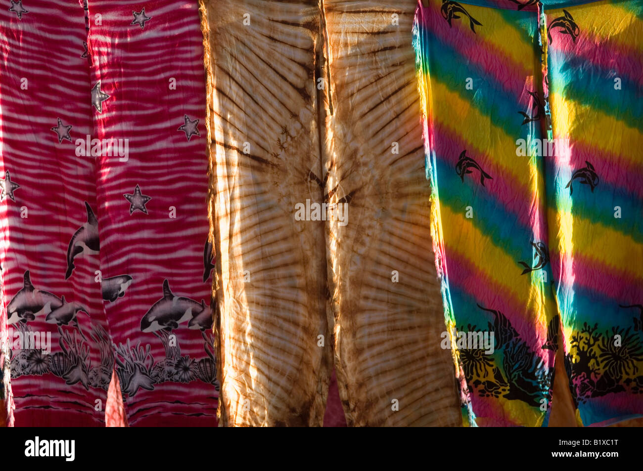 Colourful sarongs and clothes for sale on the local tourist market of ...
