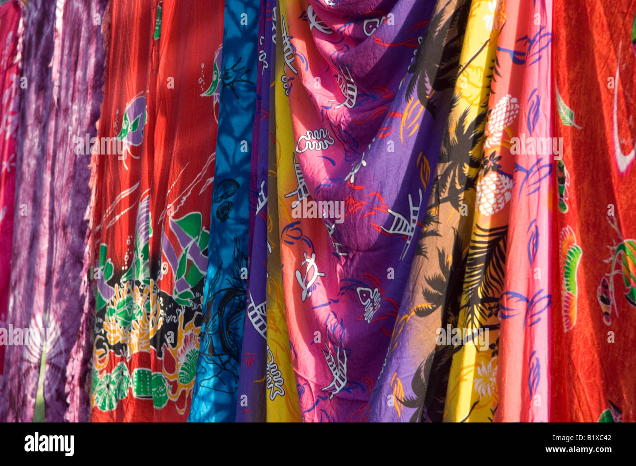 Colourful sarongs and clothes for sale on the local tourist market of ...