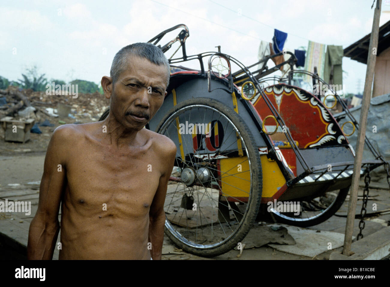 Rickshaw and rickshaw driver Jakarta Java Indonesia Stock Photo - Alamy