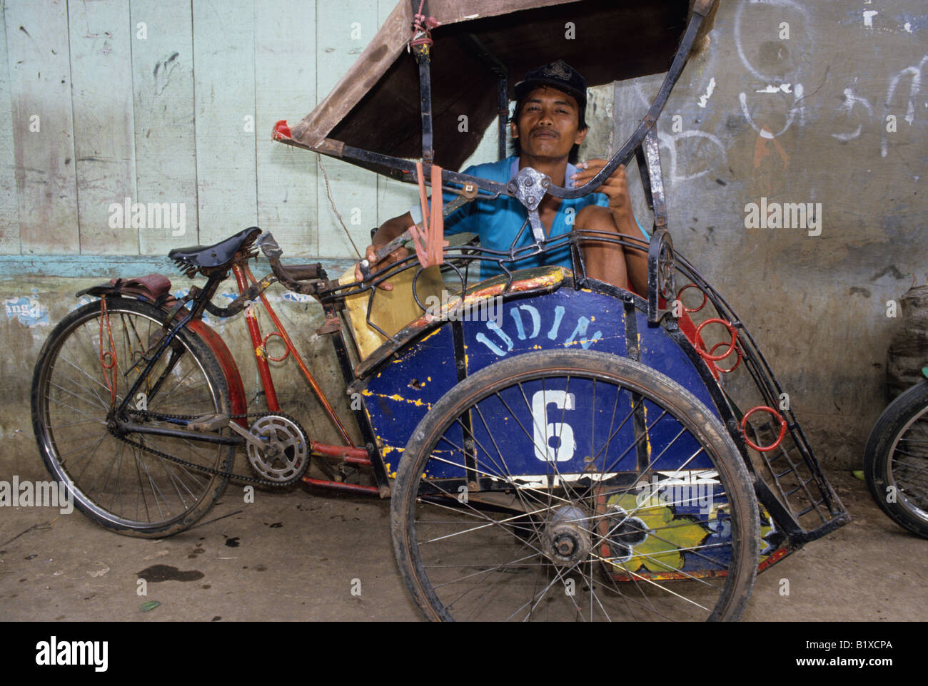 Rickshaw and rickshaw driver Jakarta Java Indonesia Stock Photo - Alamy
